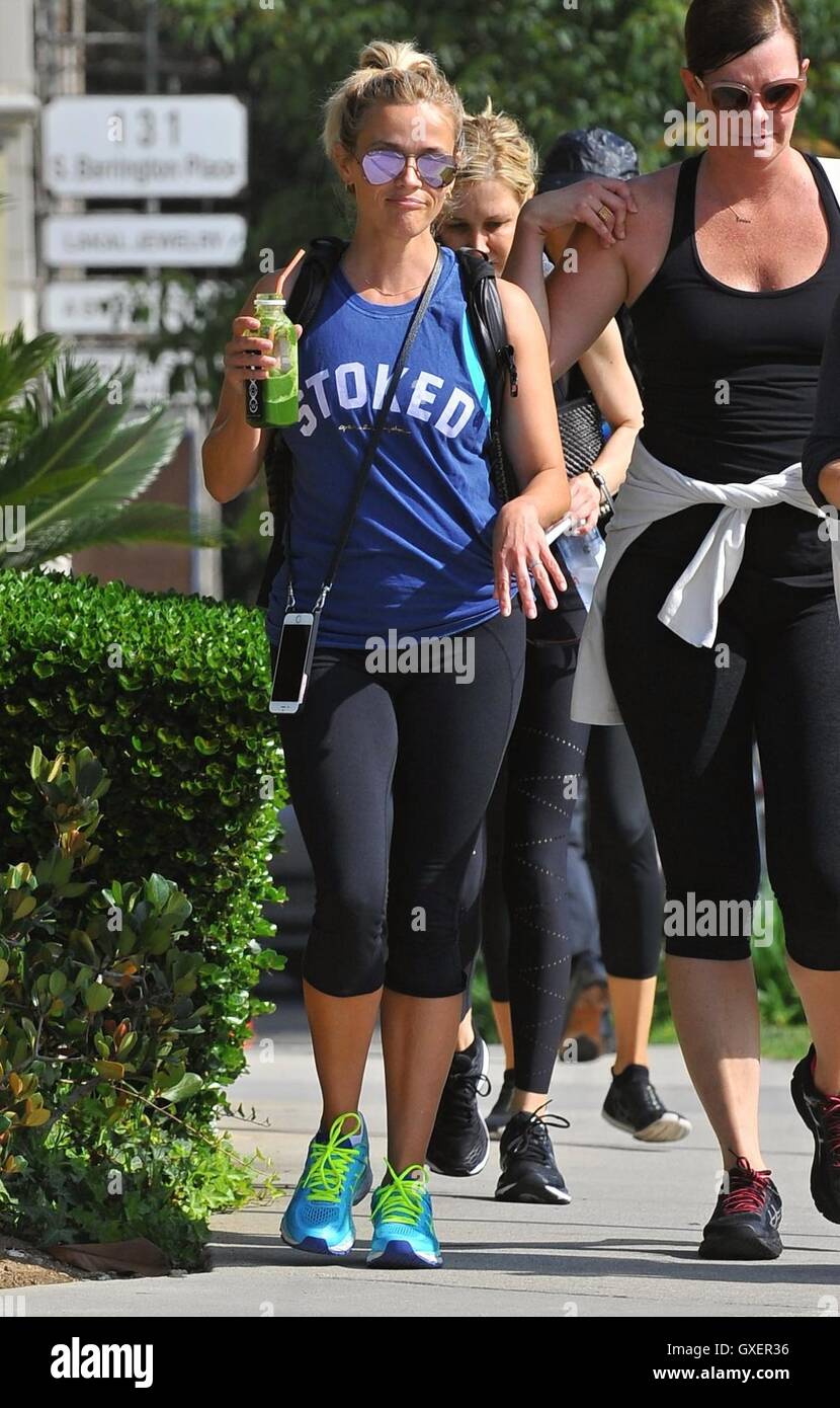 Reese Witherspoon drinks a healthy green juice as she leaves an ...