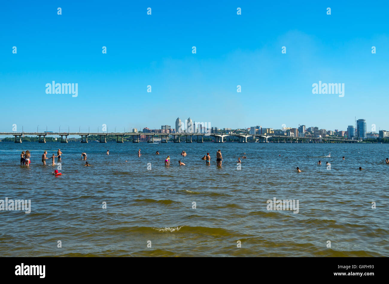 View of the city's waterfront and bridge from the opposite bank of the ...