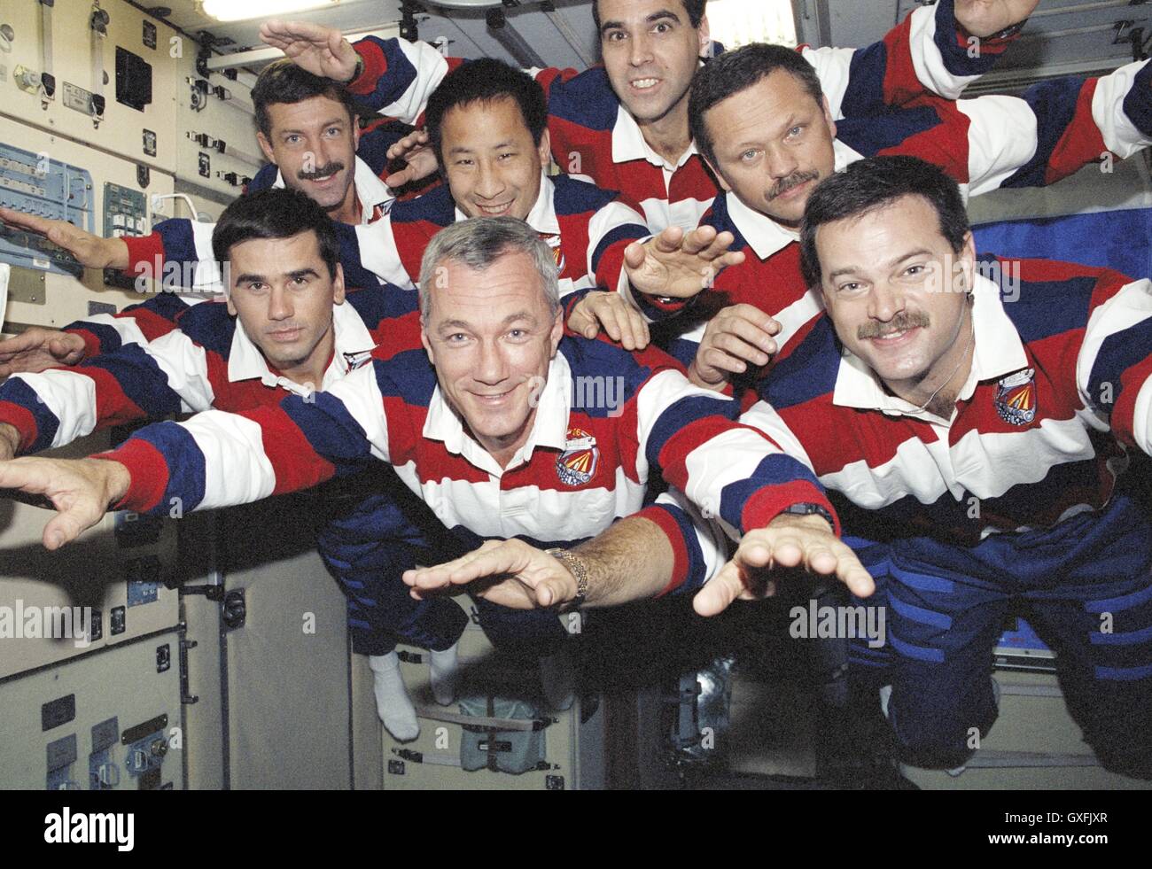 International Space Station STS-106 mission crew members hold a Superman pose during a group ...