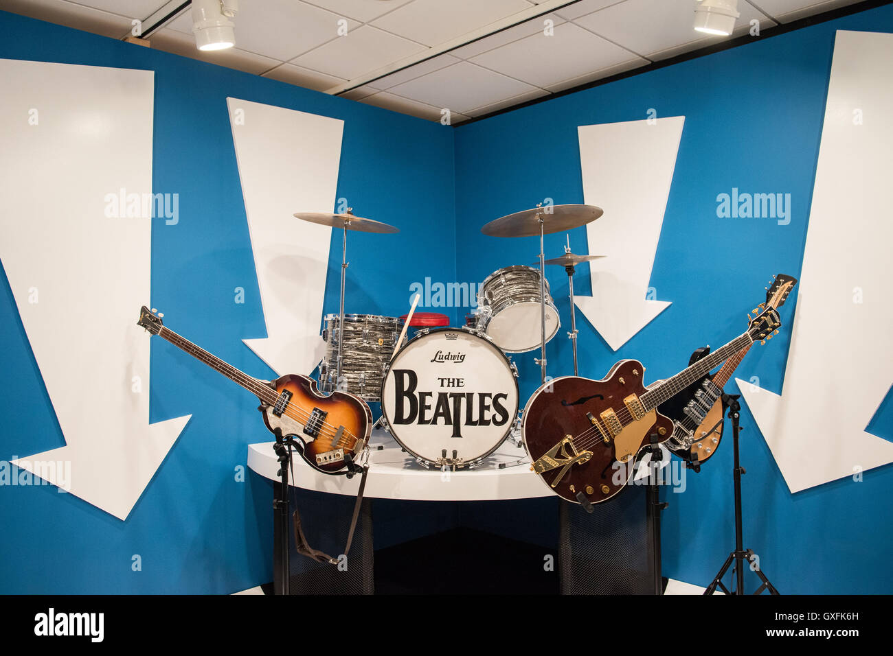The Beatles iconic instruments sit in an arrow stage set inspired by ...