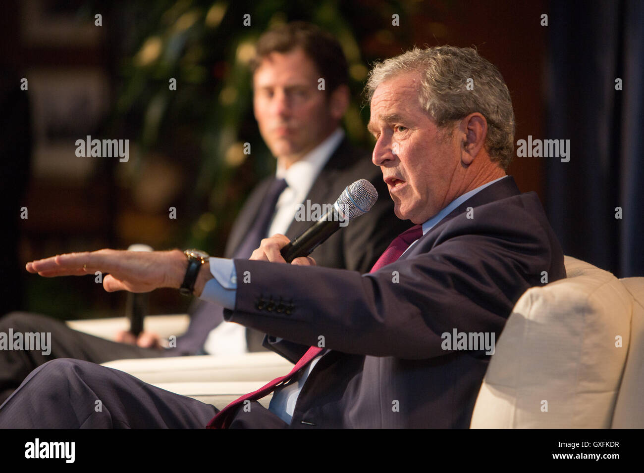 Former U.S. President George W. Bush talks during an appearance at the ...