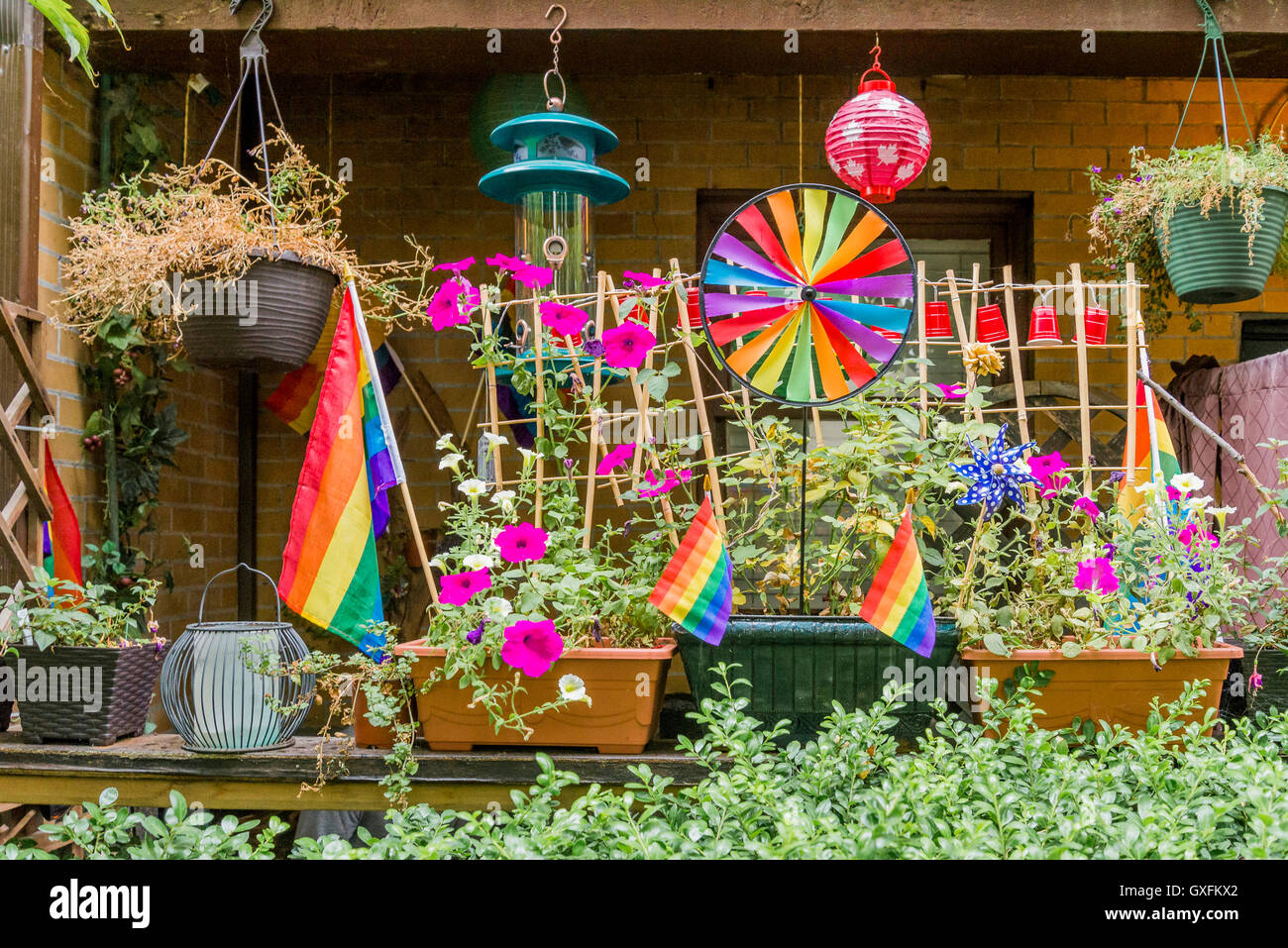 Rainbow flags garden gay pride rainbow flags in garden hi-res stock ...