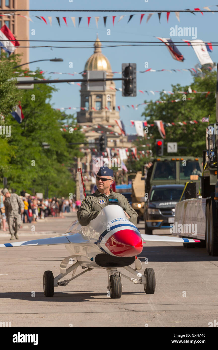 An Air Force officer rides in a miniature fighter jet during the ...