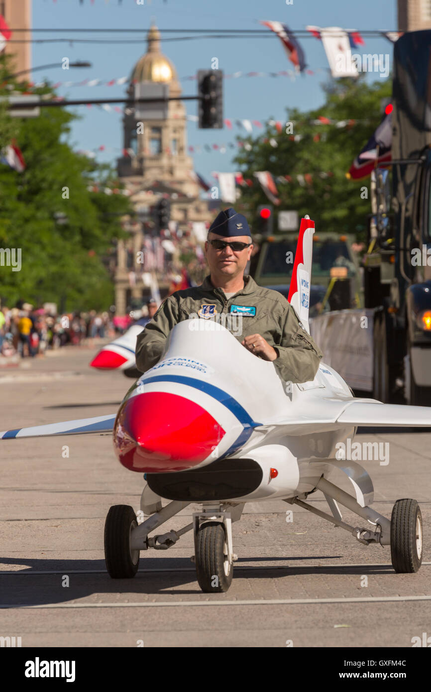 An Air Force officer rides in a miniature fighter jet during the ...
