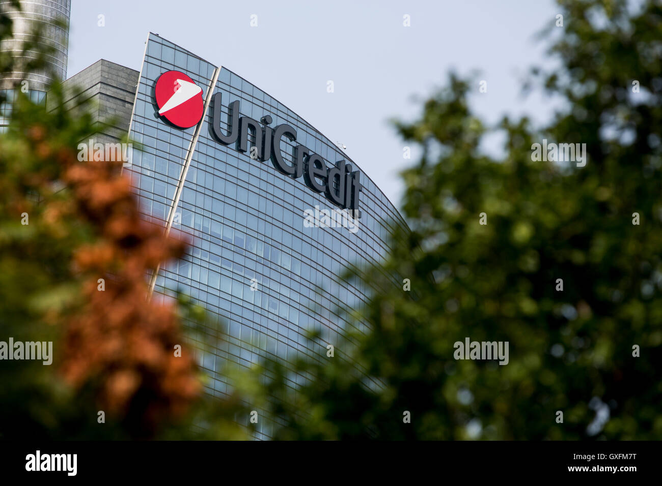A logo sign outside of the headquarters of the UniCredit Group in Milan ...