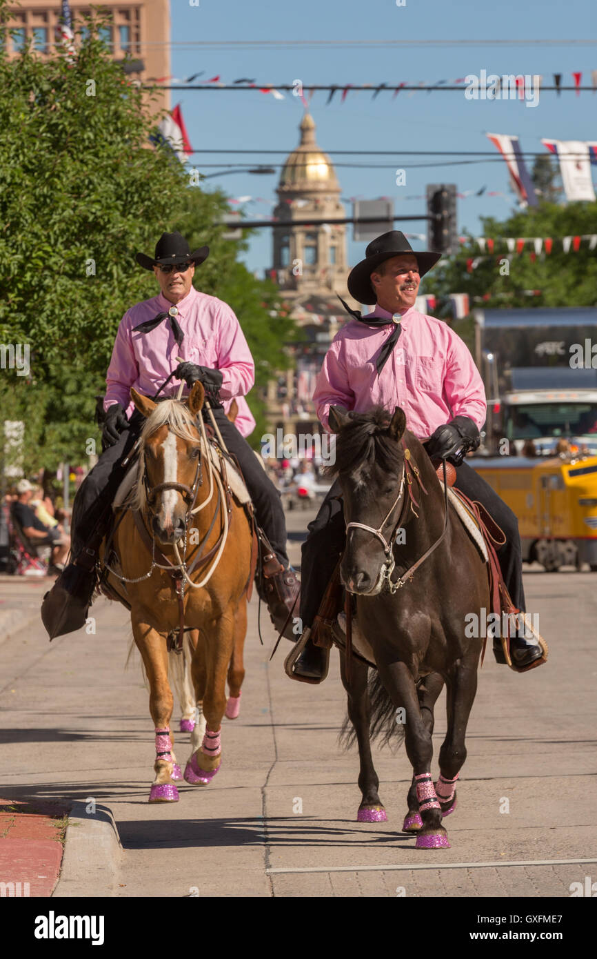 Cowboys riding in the Cheyenne Frontier Days parade past the state ...