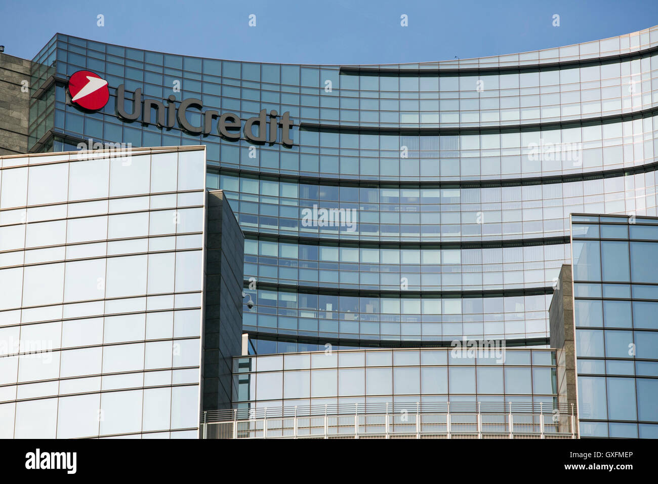 A logo sign outside of the headquarters of the UniCredit Group in Milan ...
