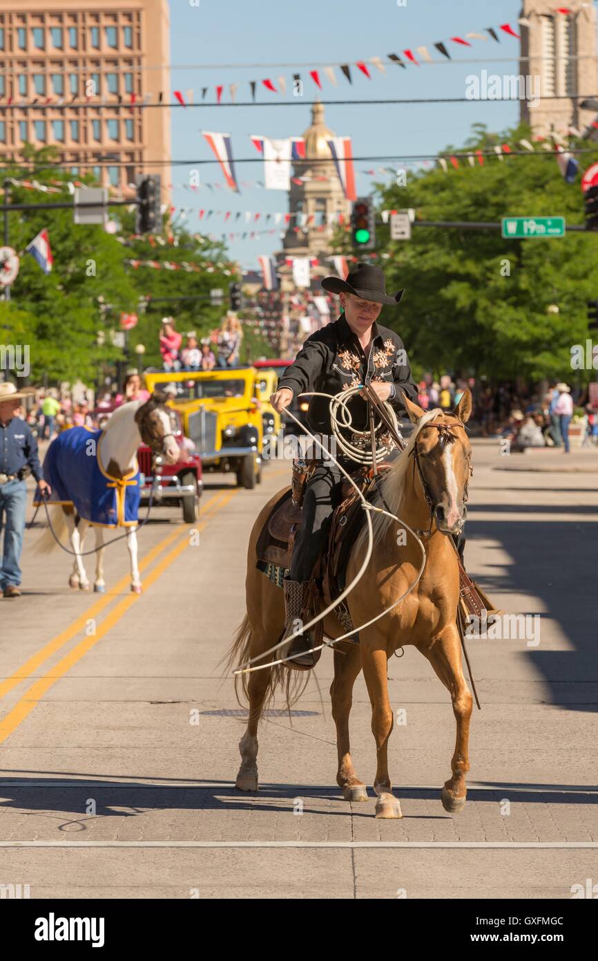 A cowboy shows off roping skills during the Cheyenne Frontier Days ...