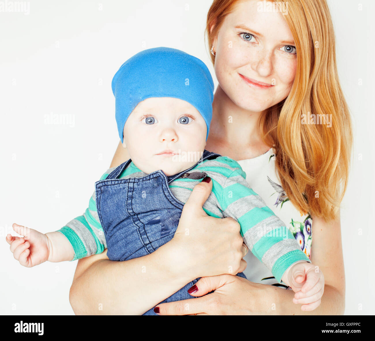 young beauty mother with cute baby, red head happy modern family ...