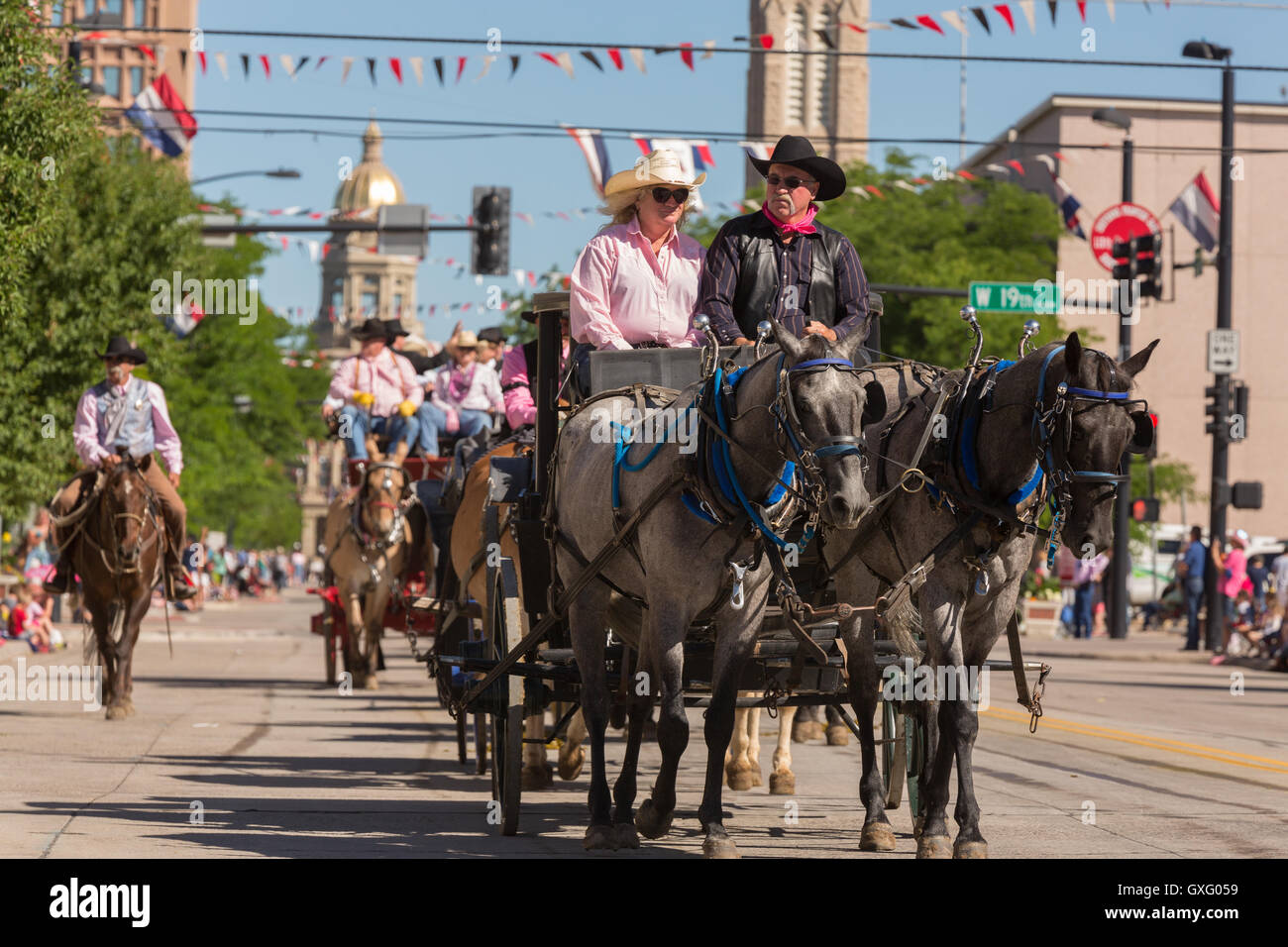 Cowboys soldiers dressed in period costume riding in the Cheyenne ...