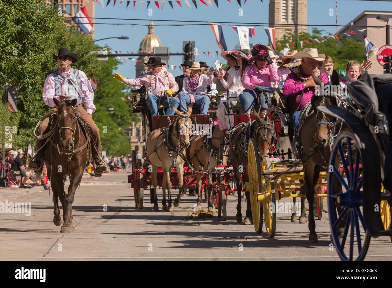 Cowboys soldiers dressed in period costume riding in the Cheyenne ...