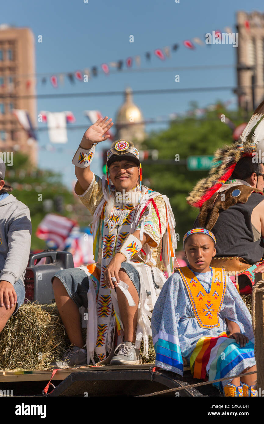 Native American Indians wave during the Cheyenne Frontier Days parade ...