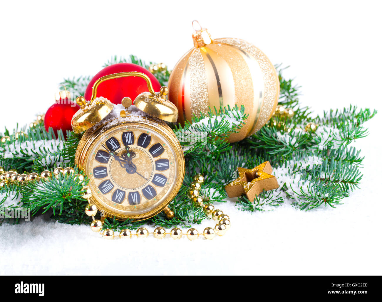Christmas clock with festive decorations on snow background Stock Photo ...