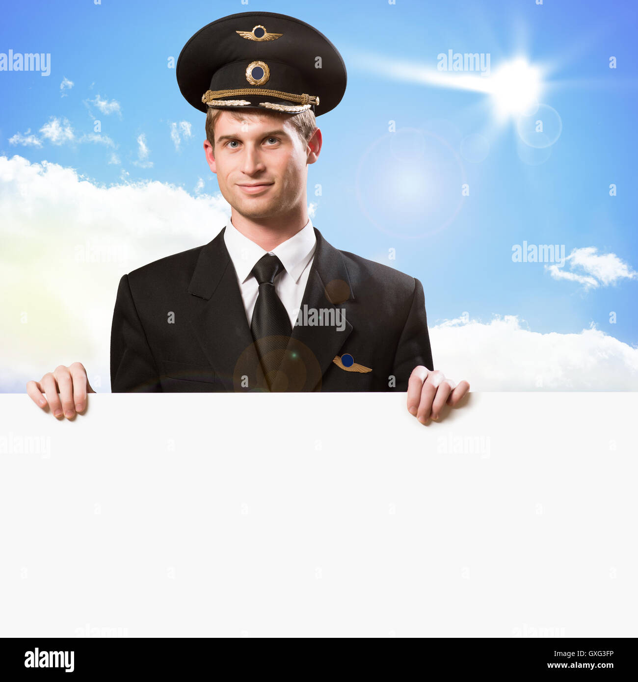 pilot in the form of holding an empty billboard Stock Photo - Alamy