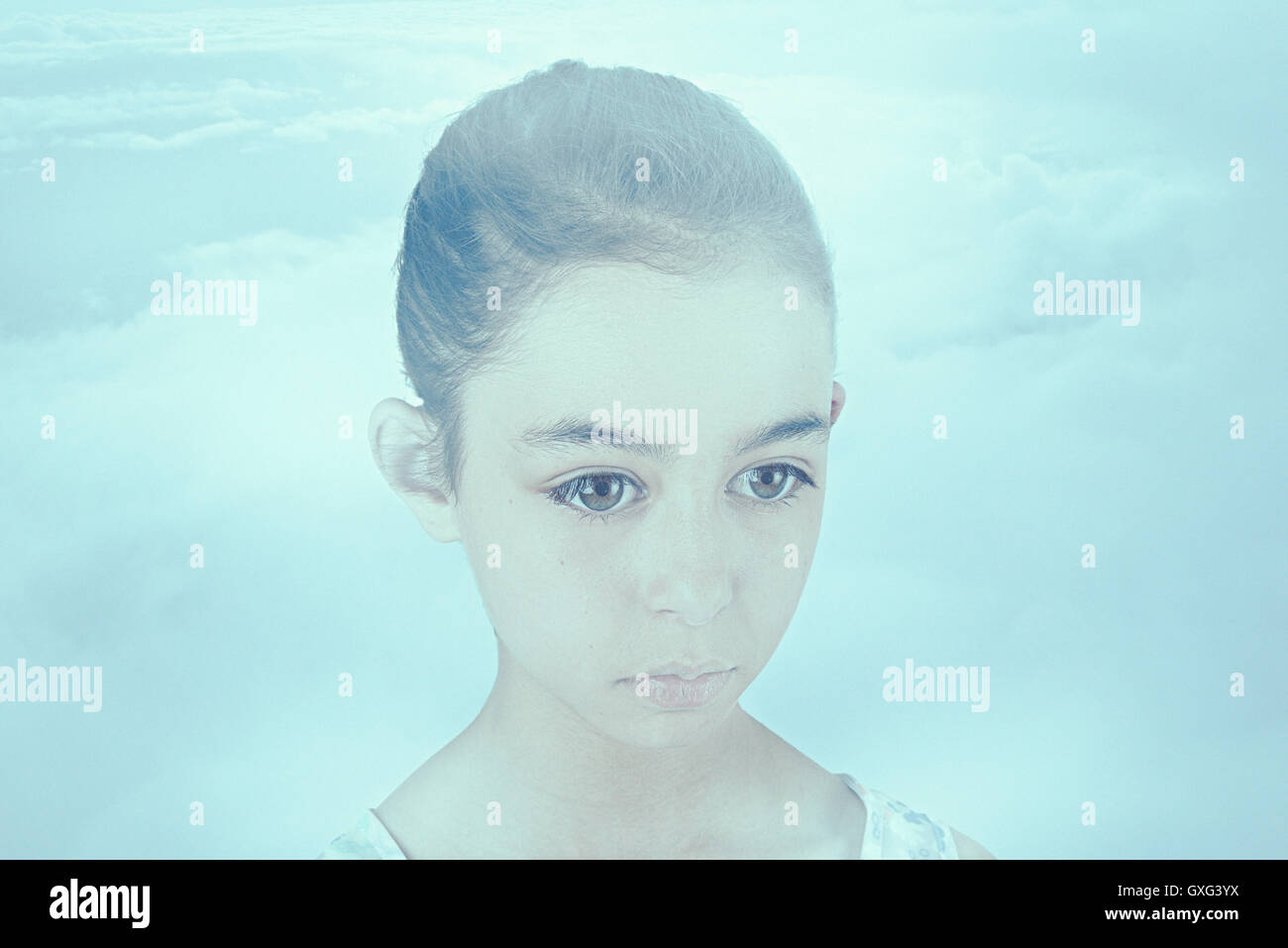 Face of wide-eyed Mixed Race girl in clouds Stock Photo - Alamy
