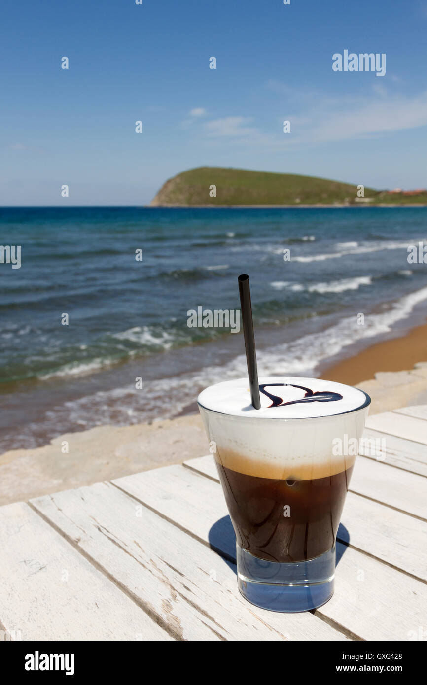 A cup of Greek coffee freddo cappuchino, at the town of Myrina, in ...