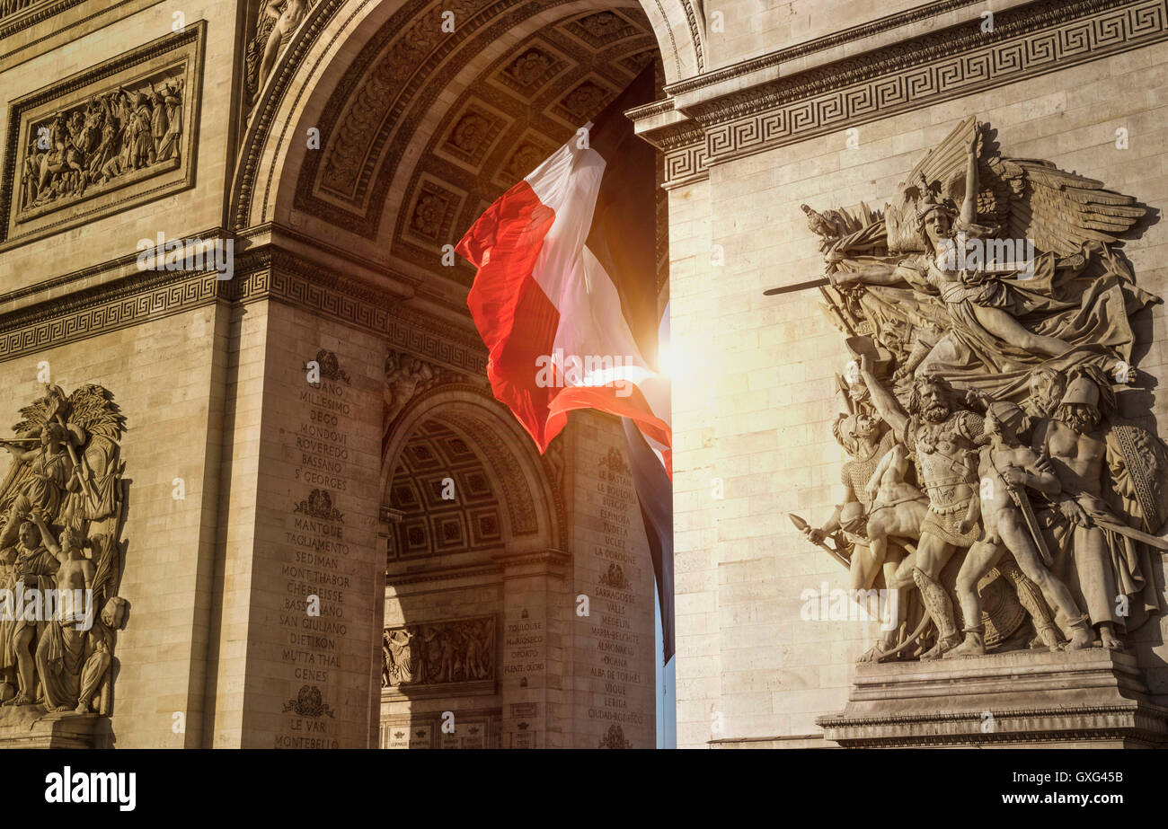 Flag in arch near statues Stock Photo - Alamy