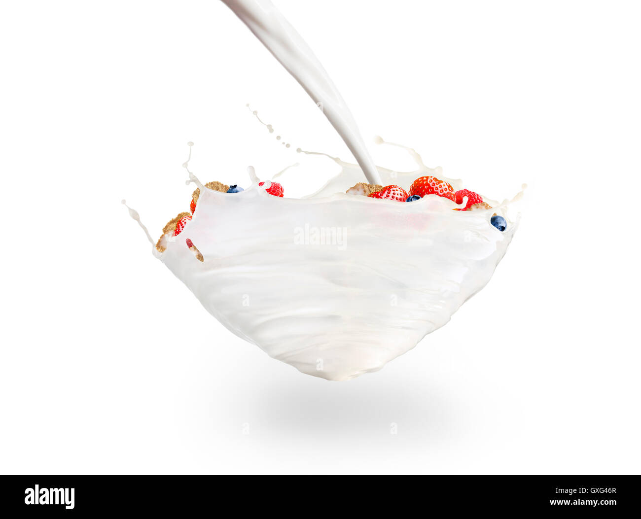 Floating milk splashing on cereal with fruit Stock Photo - Alamy
