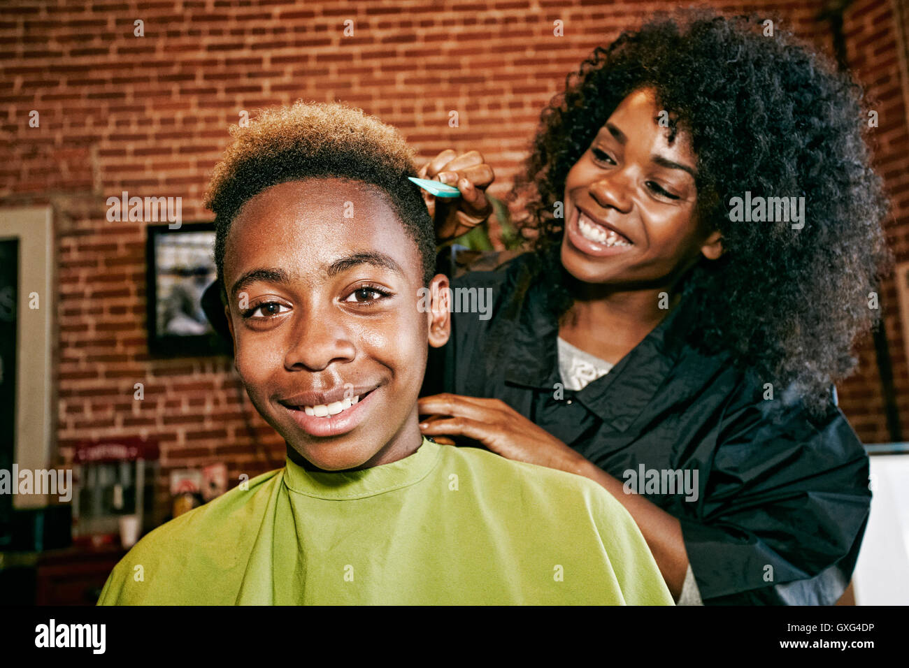 Smiling hairdresser and customer in hair salon Stock Photo - Alamy