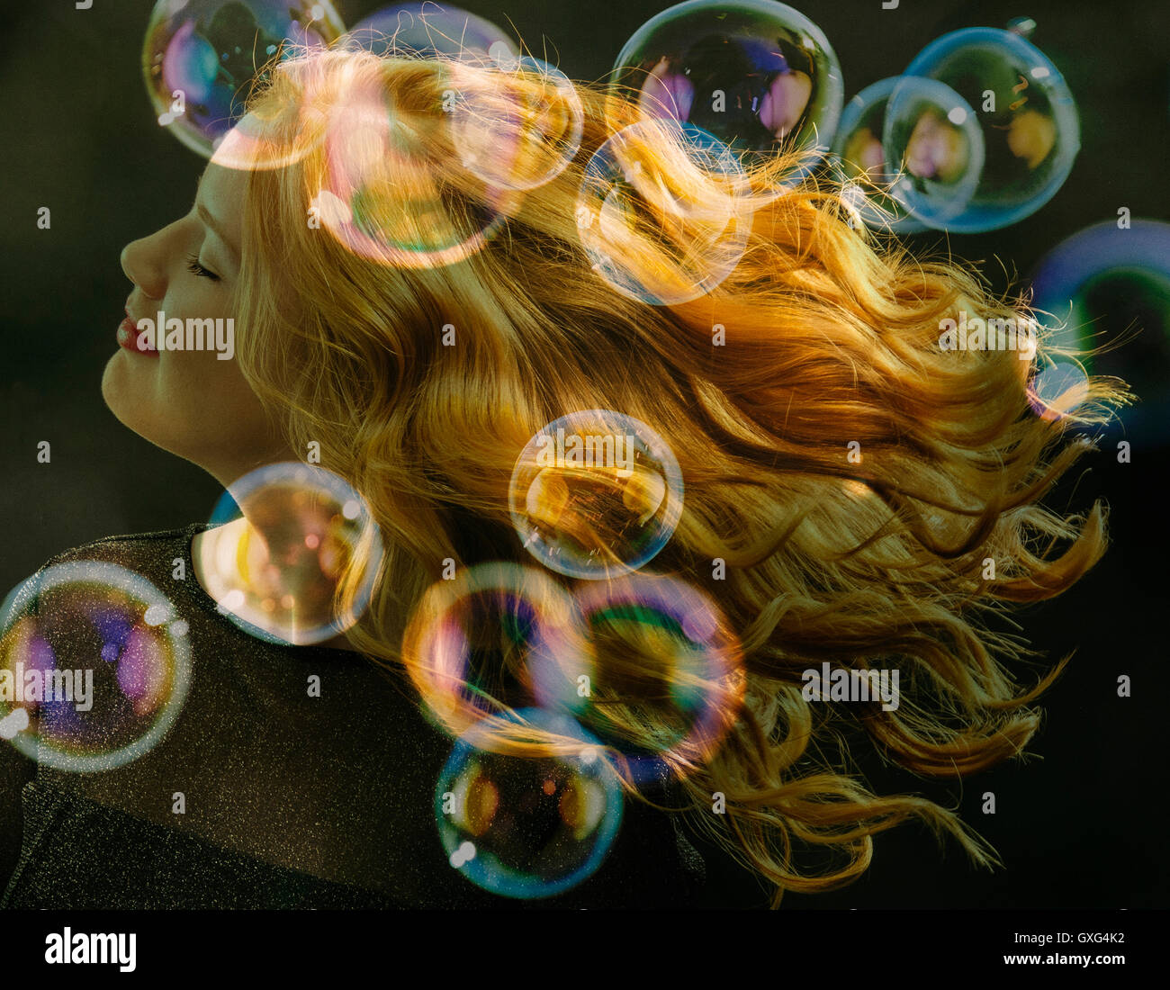 Bubbles floating near smiling Caucasian woman Stock Photo - Alamy