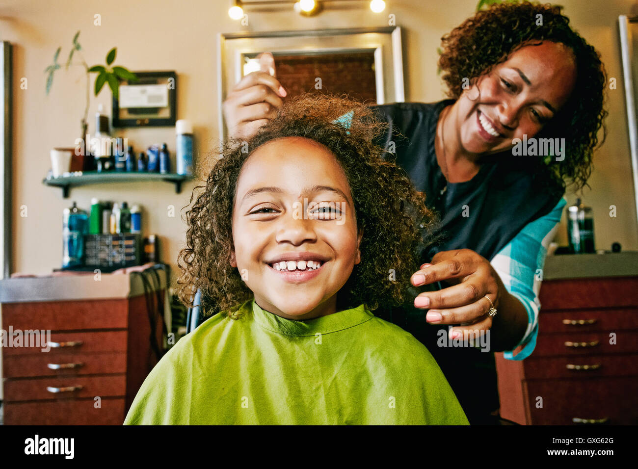 Smiling hairdresser and customer in hair salon Stock Photo - Alamy