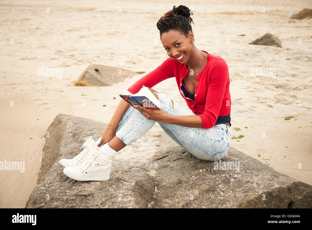 Woman Reading On Beach