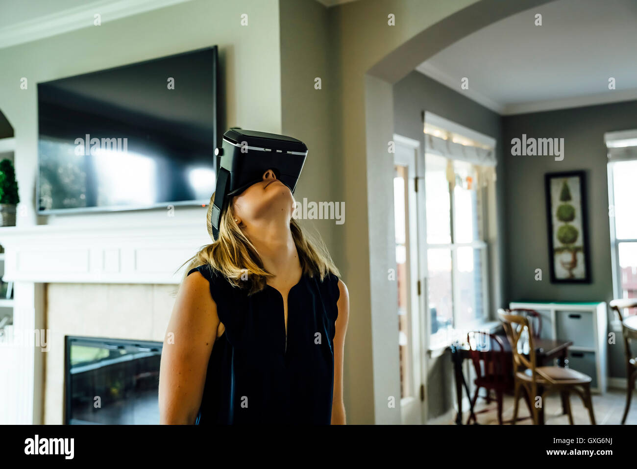 Caucasian woman wearing virtual reality goggles Stock Photo - Alamy