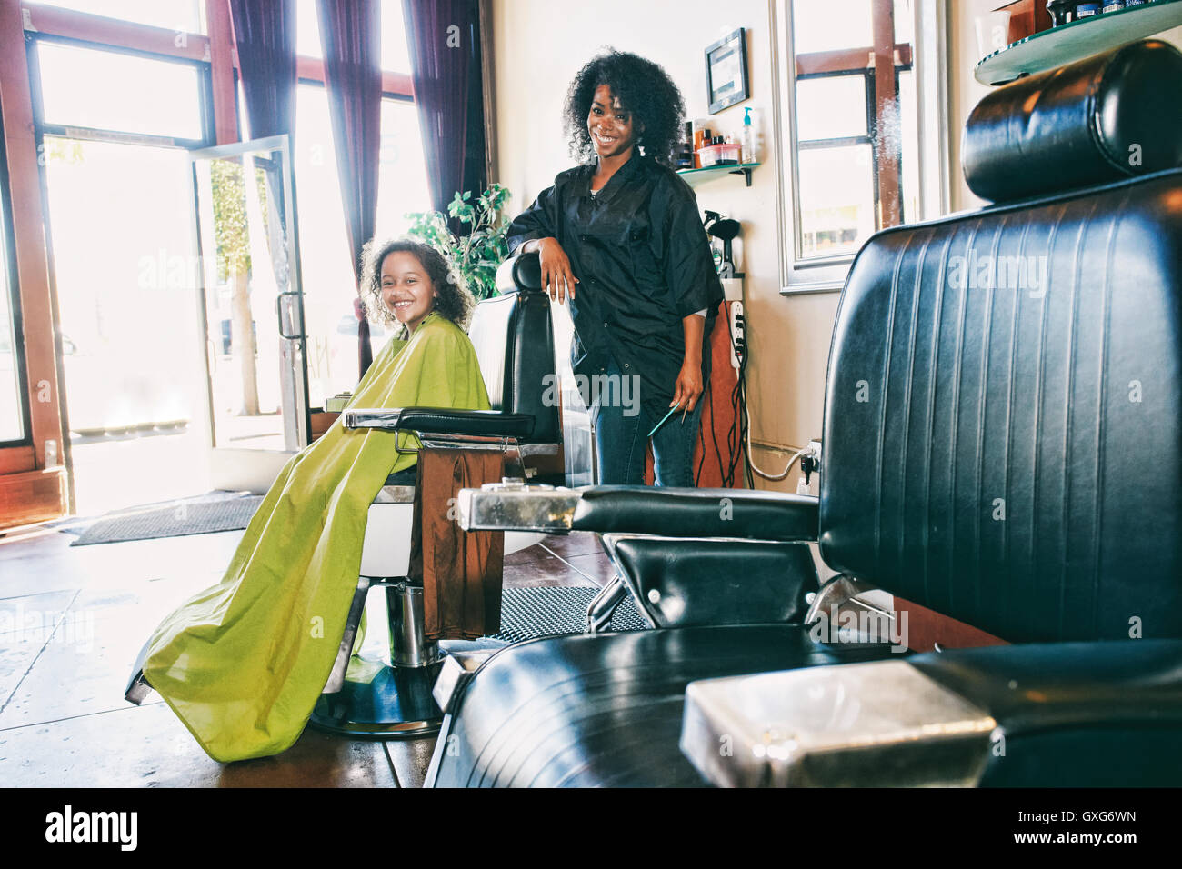 Smiling hairdresser and customer in hair salon Stock Photo - Alamy