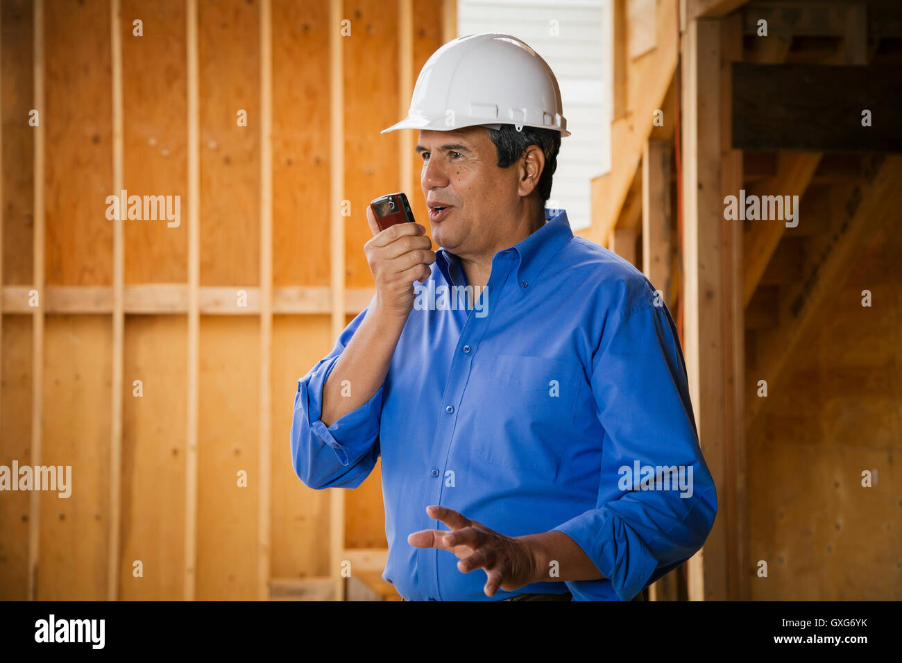 Native American construction worker talking on cell phone Stock Photo ...