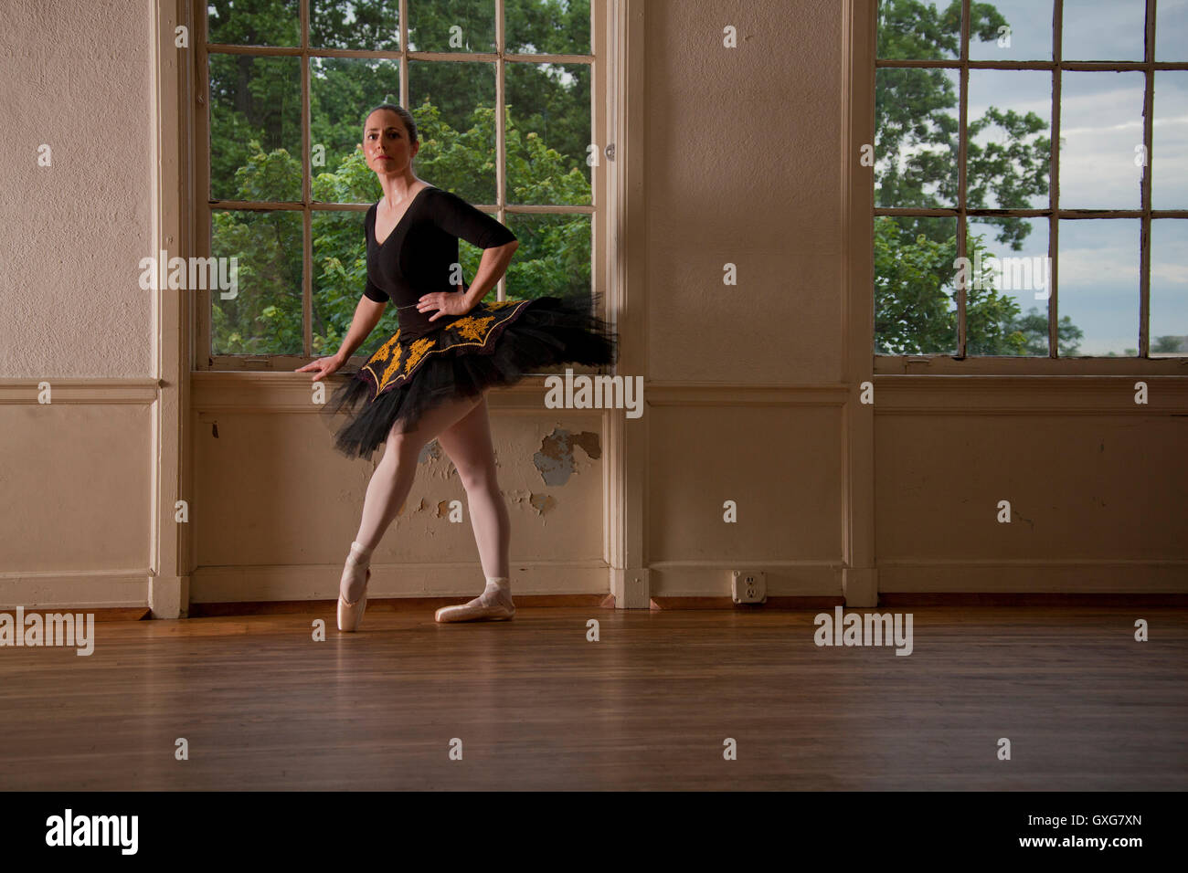 Caucasian ballerina posing at window in studio Stock Photo - Alamy