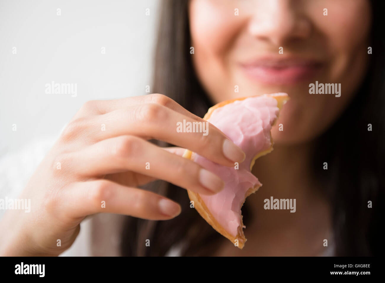 Pink donut icing hi-res stock photography and images - Alamy