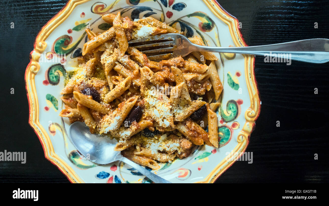 Sicilian recipe, penne rigate pasta with tuna, olives, and tomatoes ...
