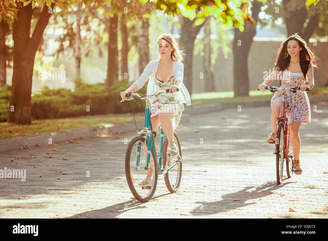 Two young girls bicycles in hi-res stock photography and images - Alamy