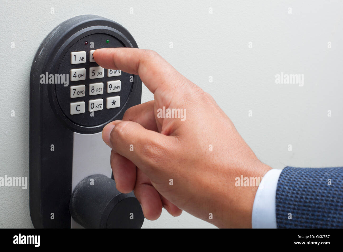 Interracial businessman hand entering security system code Stock Photo ...