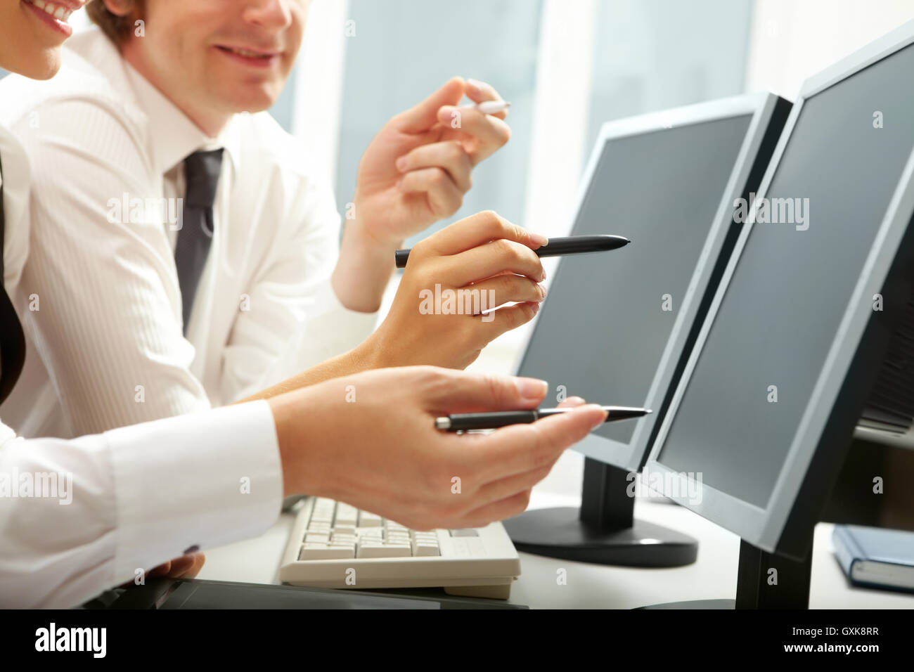 Working at computers Stock Photo - Alamy