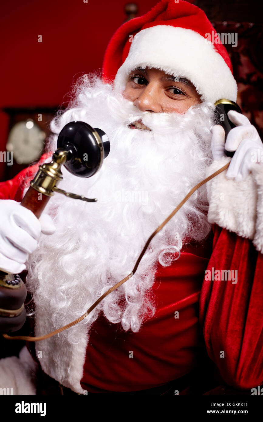 Santa with a phone Stock Photo - Alamy