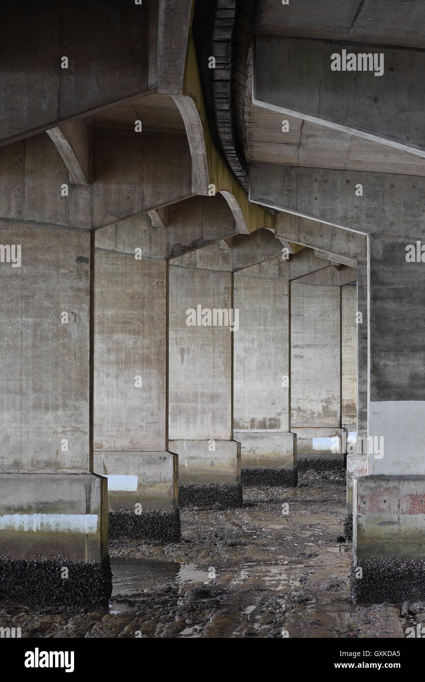 Concrete bridge pillars in shallow water Stock Photo - Alamy