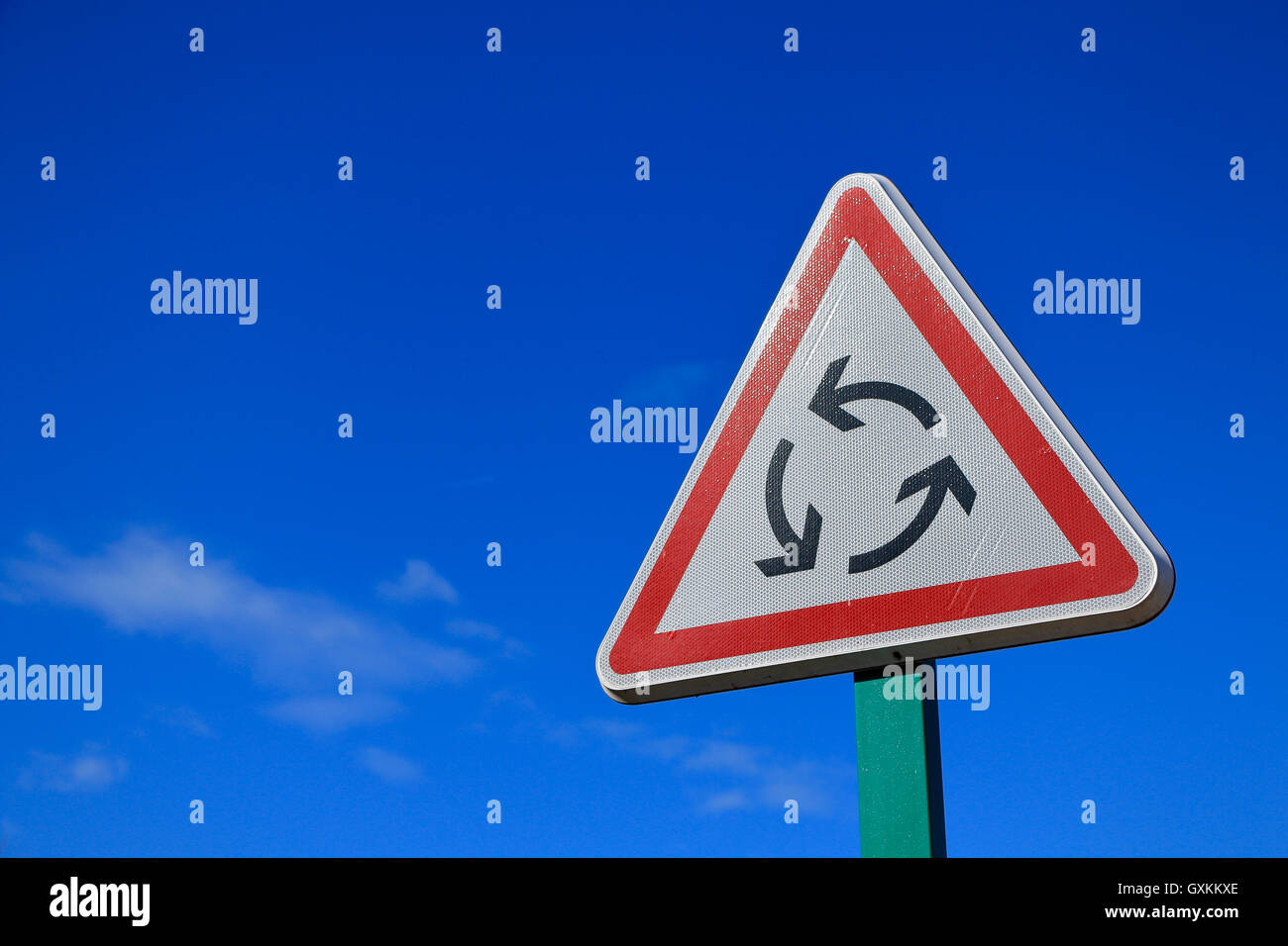 White arrow on blue round circular road sign hi-res stock photography ...