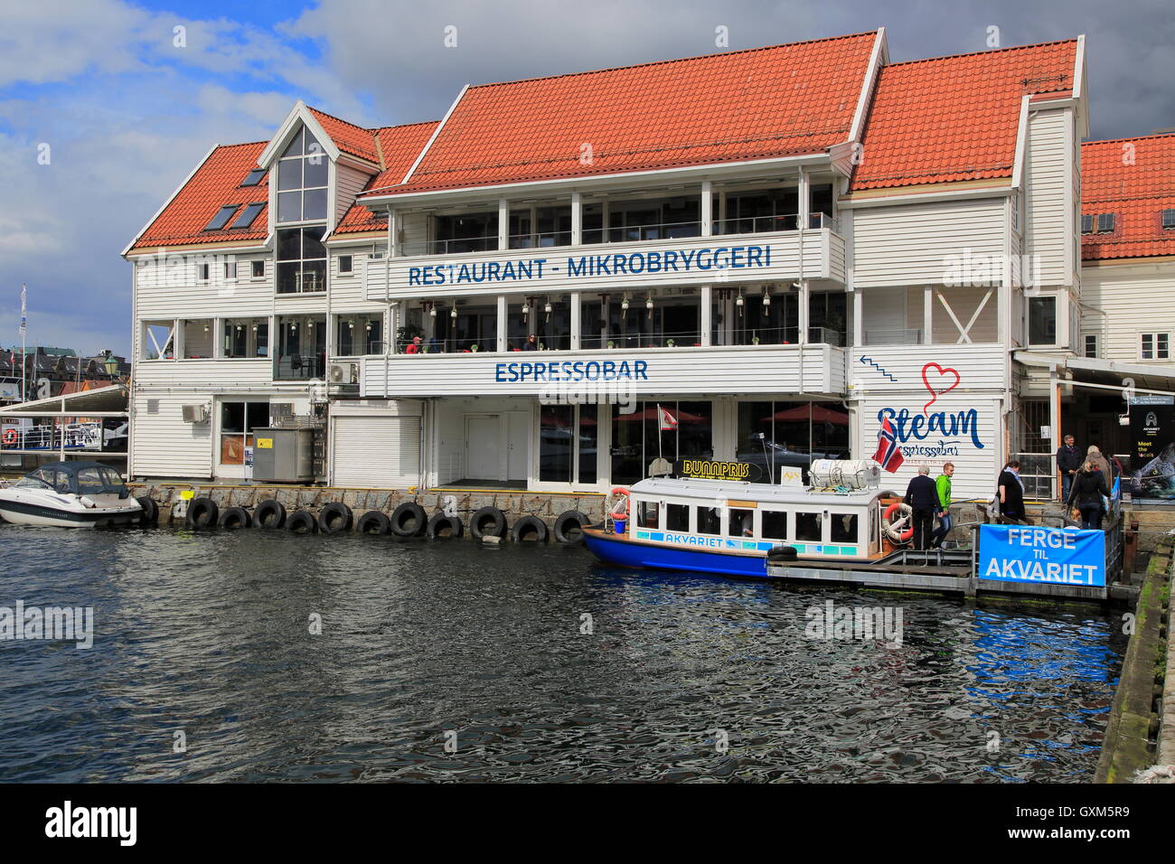 Waterside buildings and boats Vagen harbour, by Torget fish market ...