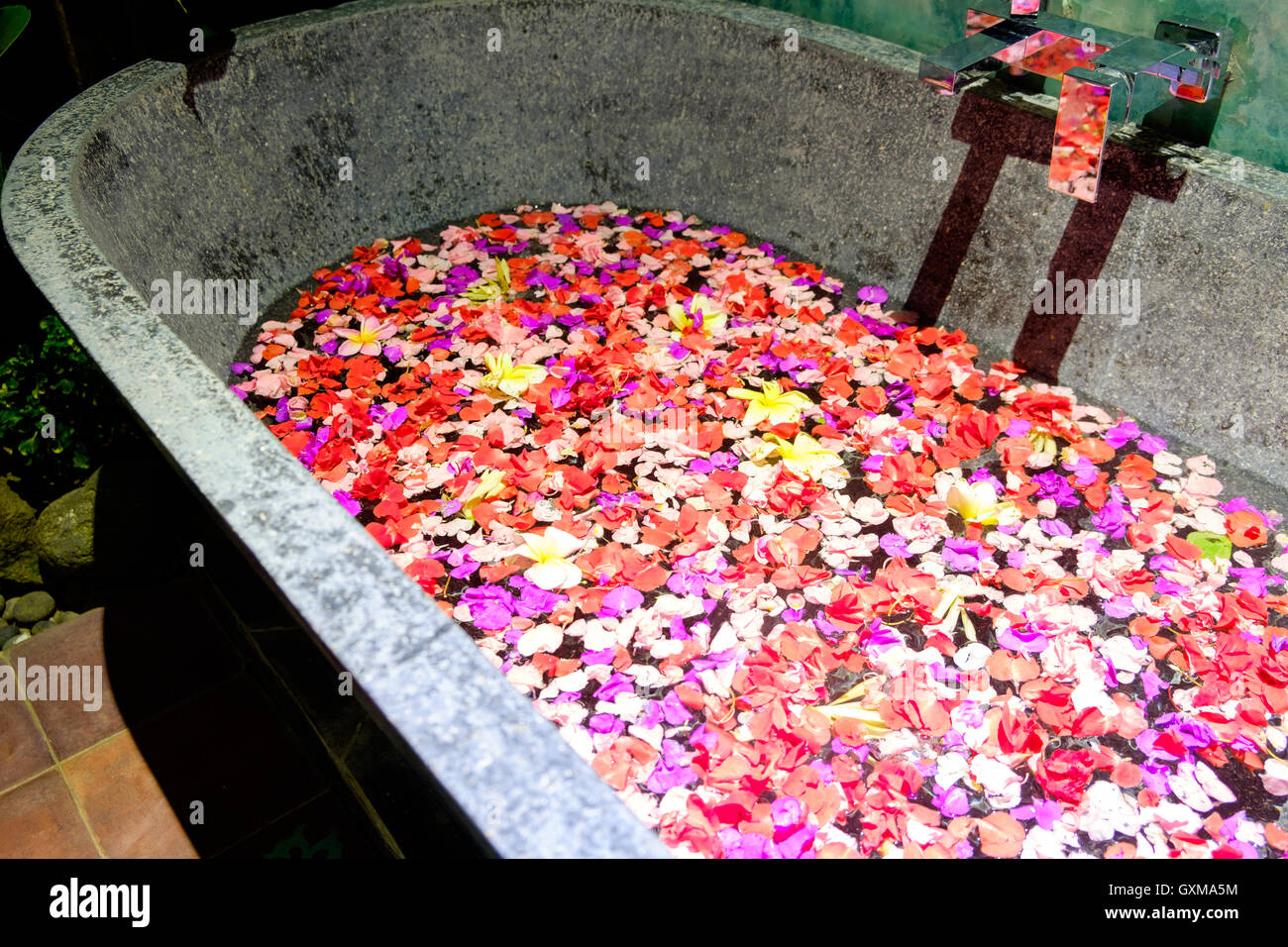 Bath filled with flowers in Bali, Indonesia Stock Photo - Alamy