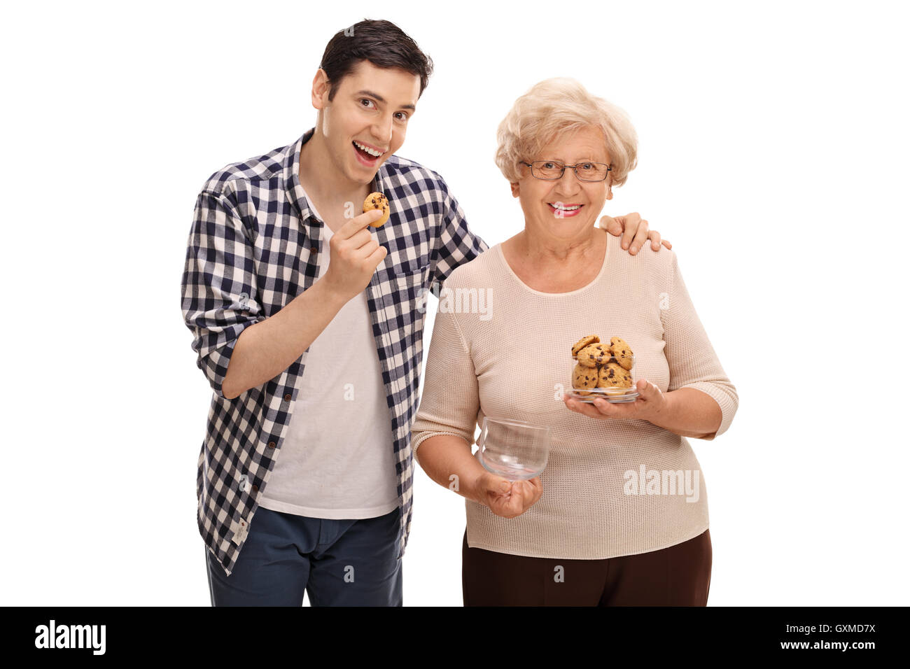 Elderly woman giving cookies to a young man isolated on white ...