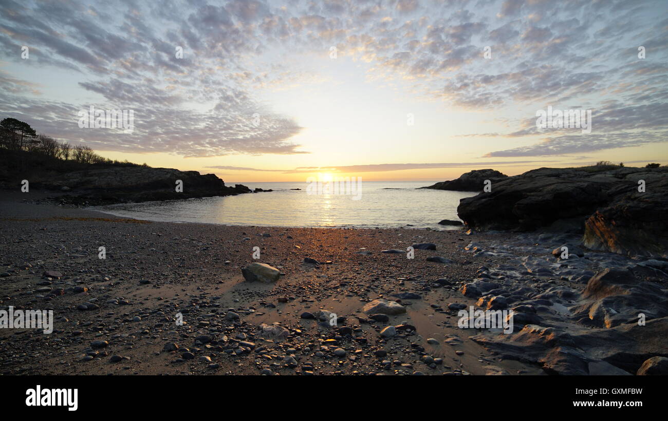 Beautiful sunrise over rocky ocean beach hi-res stock photography and ...