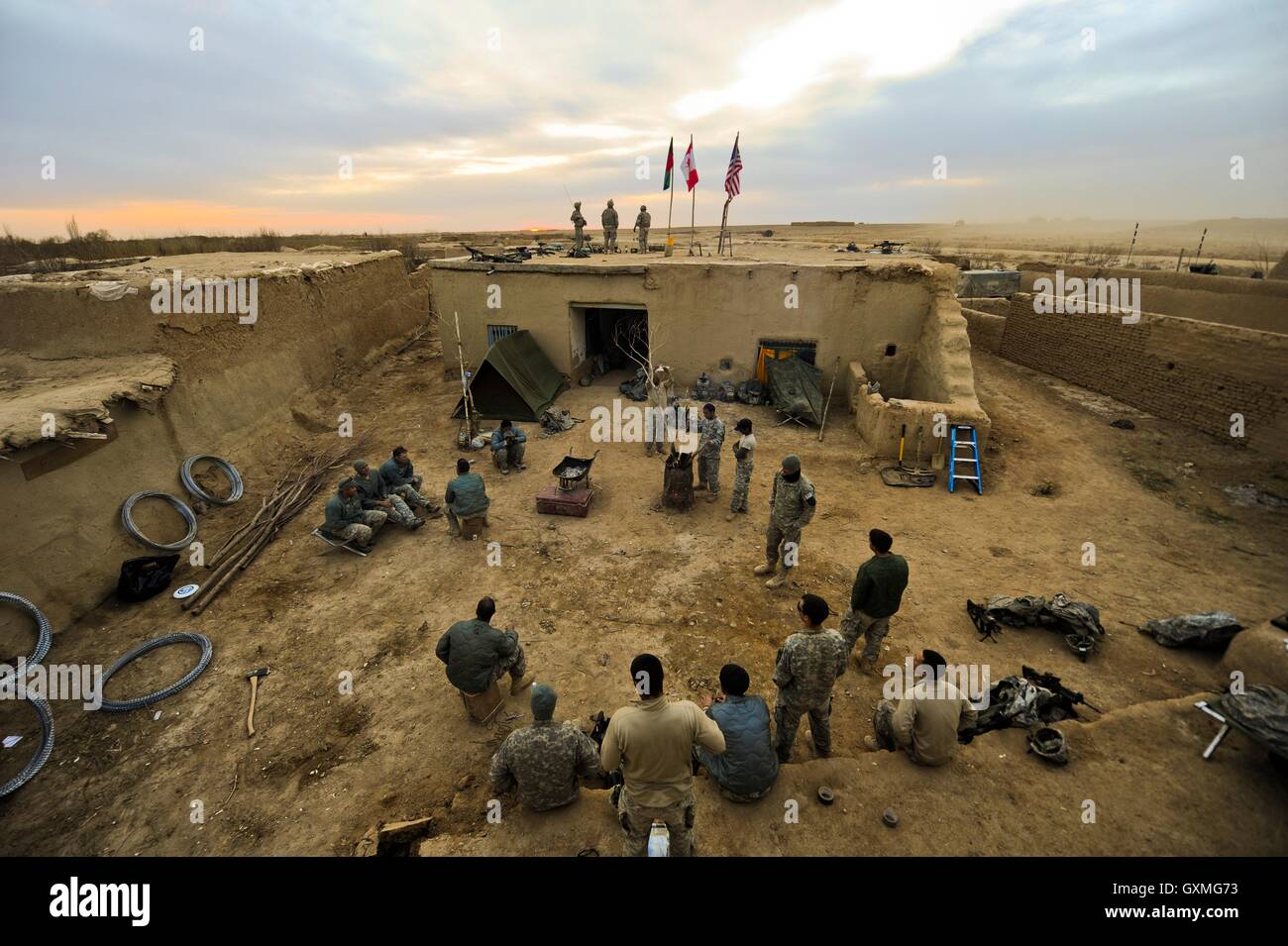 U.S. Army soldiers gather together at base after conducting a combat ...