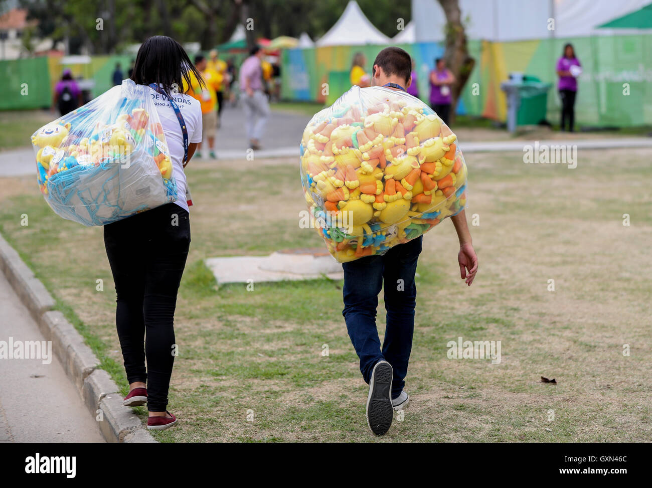 Rio de Janeiro, Brazil. 16th September, 2016. Volunteers carry bags of ...