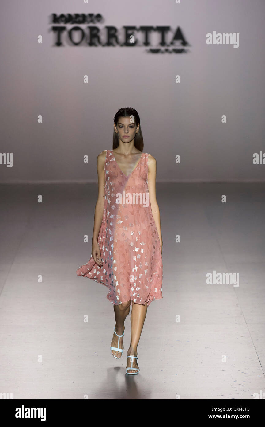 A model wears at collection runway a creation from Roberto Torretta ...