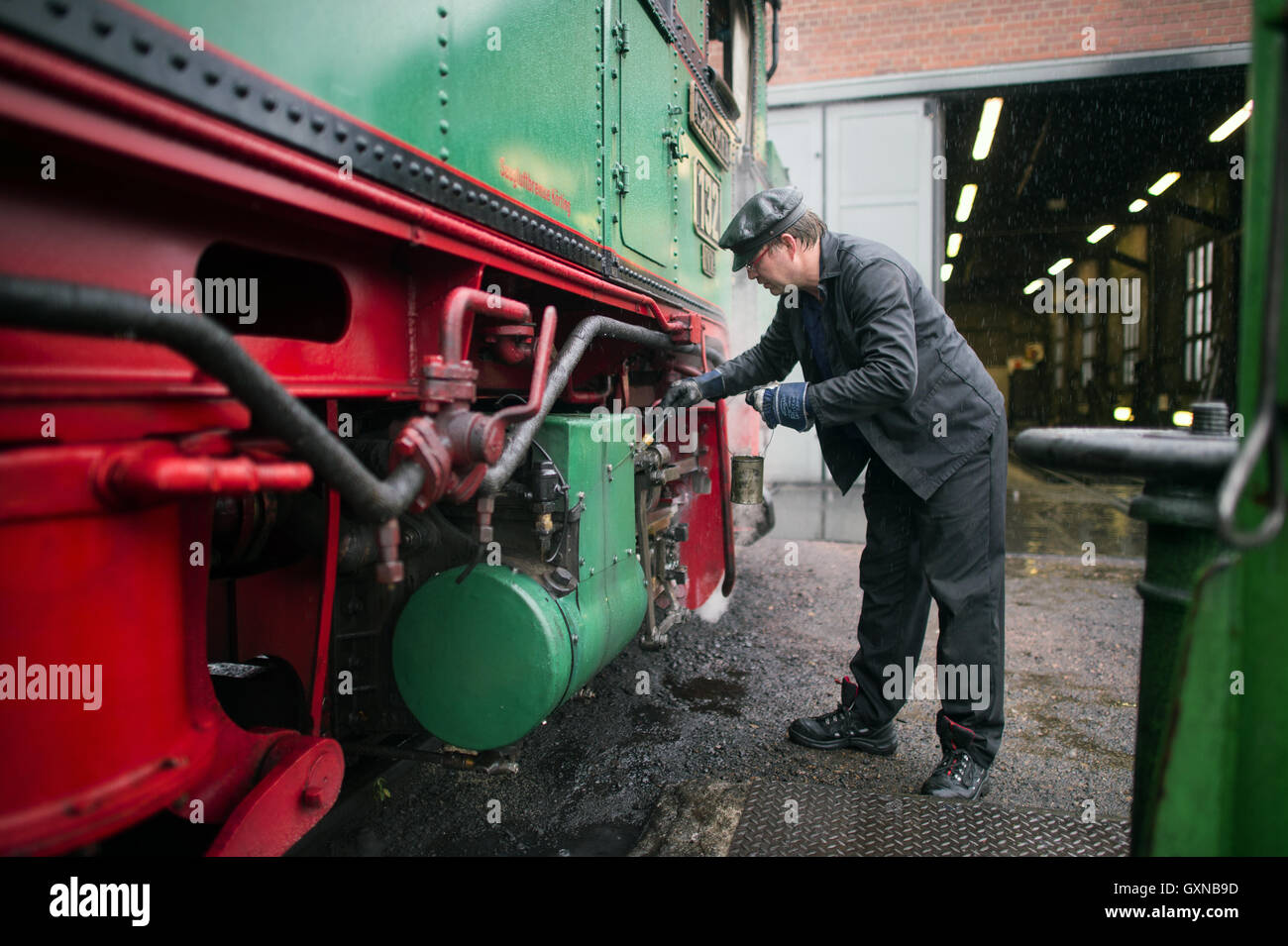 Radebeul, Germany. 17th Sep, 2016. Stoker Daniel Menzel prepares the ...