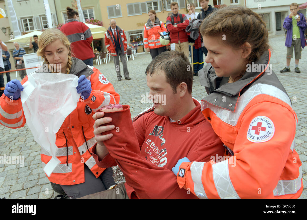 Anna Jorgel (L) and Lisa Uhlig (R) treat Julian Haeuserer, who is ...