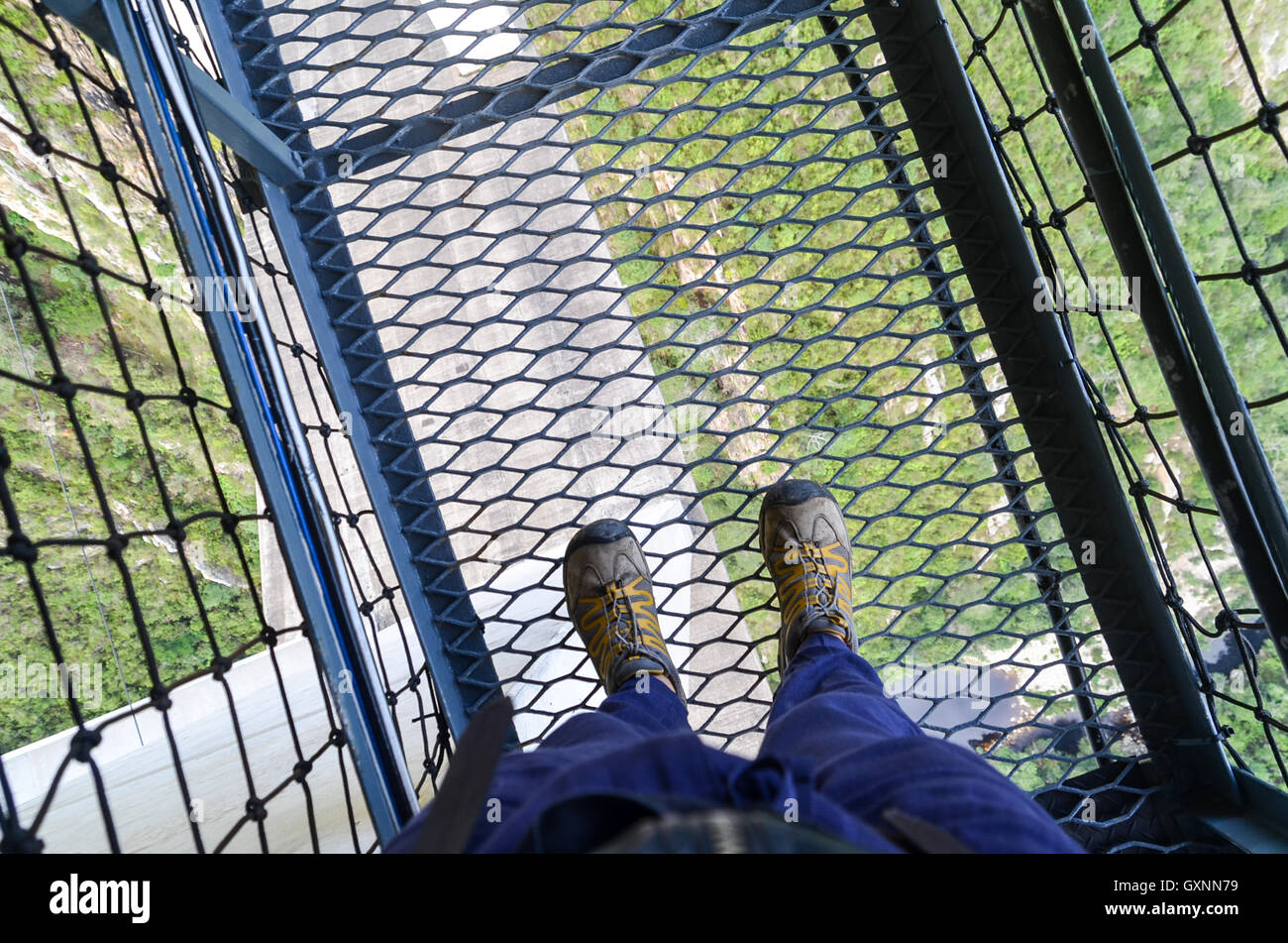 Walking on a footbridge at height, above a 200m drop Stock Photo - Alamy
