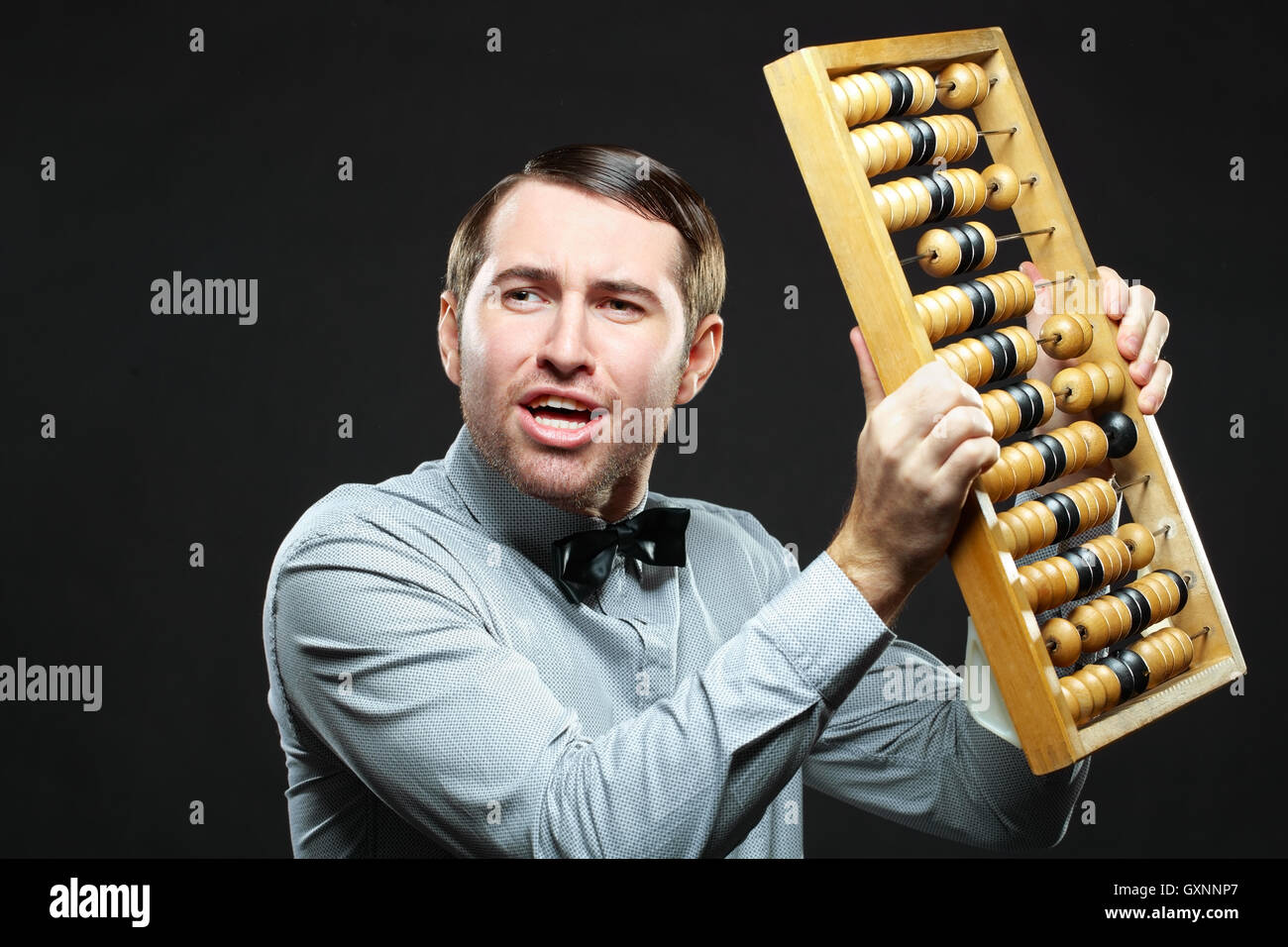 Businessman with abacus Stock Photo - Alamy