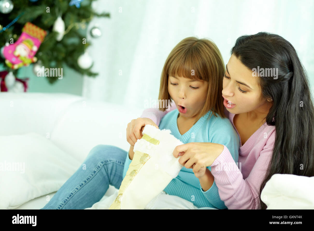 Child opening christmas present shock hi-res stock photography and ...